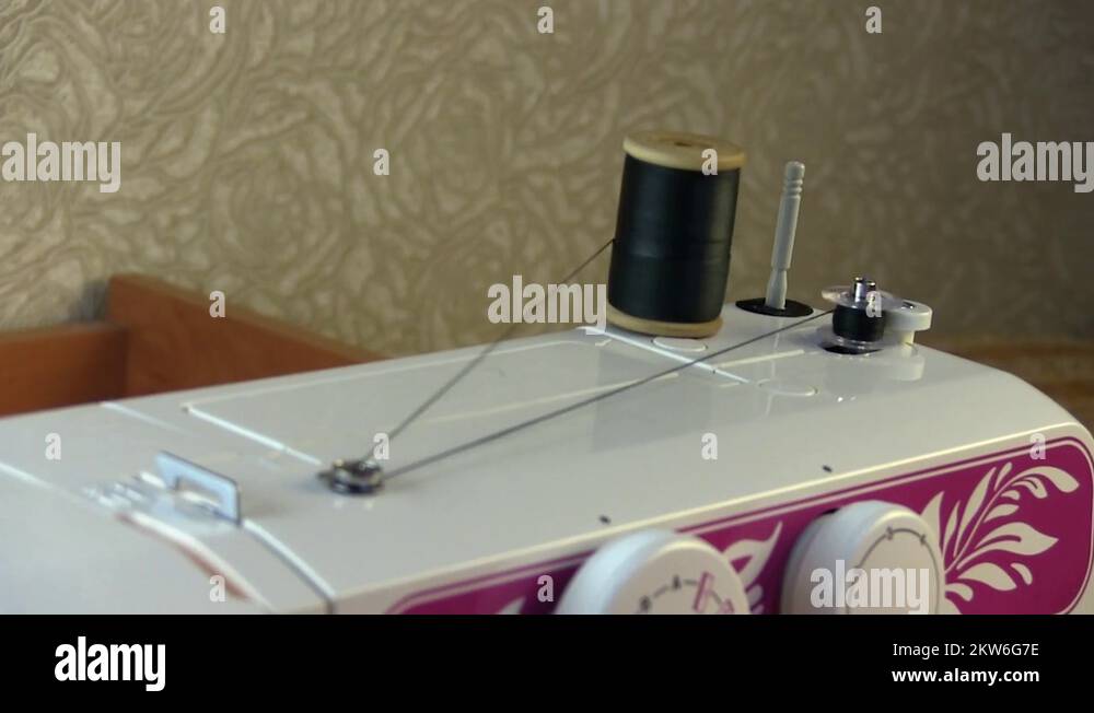 A Seamstress Is Winding A Black Tread On A Spool Stock Video Footage ...