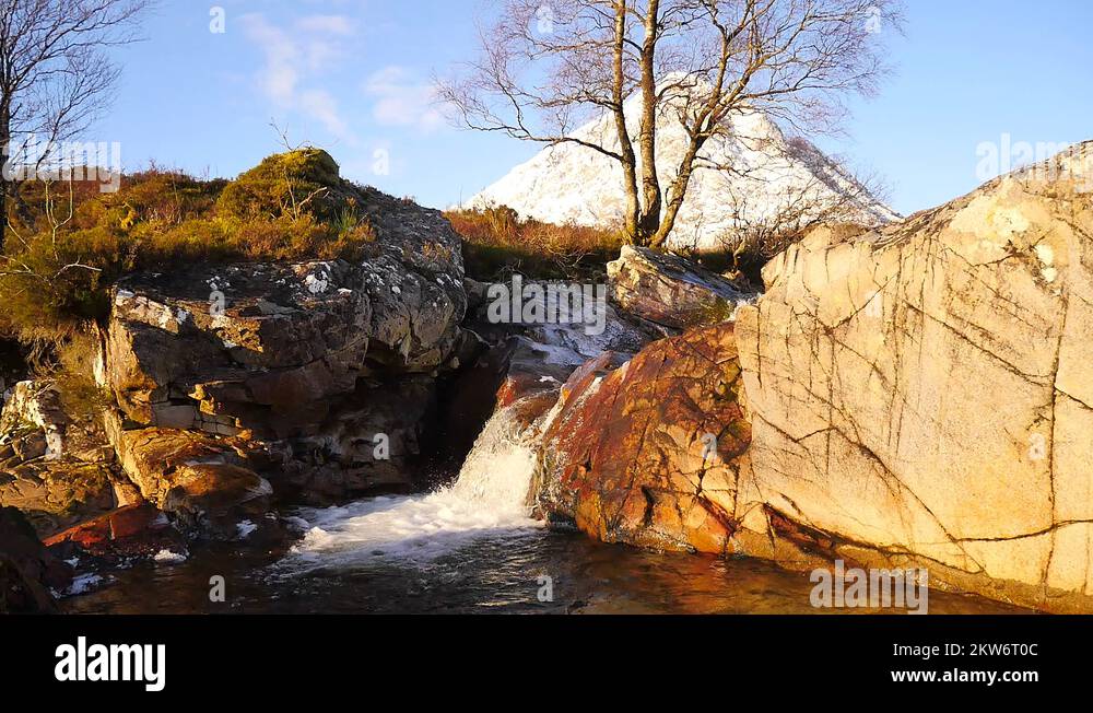 Well known waterfall on river Etive. Snowy cone of Higland in Scotland ...