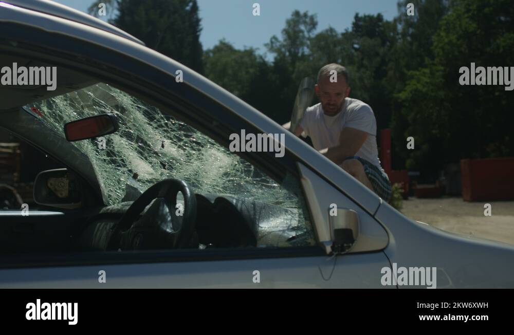 4K Aggressive man with anger issues smashing up car with a baseball bat ...
