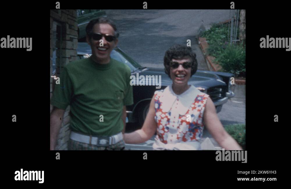 1972 Husband and wife kiss and relax outside hotel room Stock Video Footage - Alamy