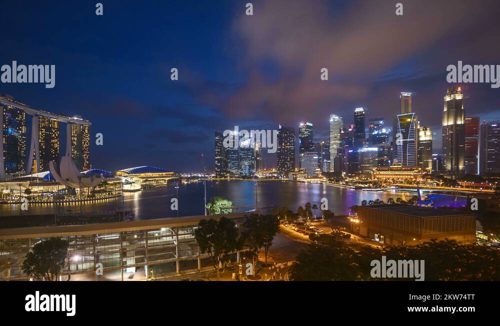 Dusk to Night scene at Marina Bay Singapore Skyline with laser light ...