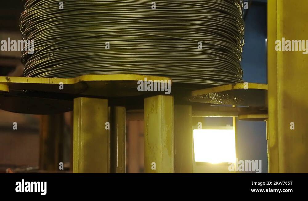 Rolled steel, rod is hot-rolled on rod mills, wire rod is wound into coils Stock Video Footage ...
