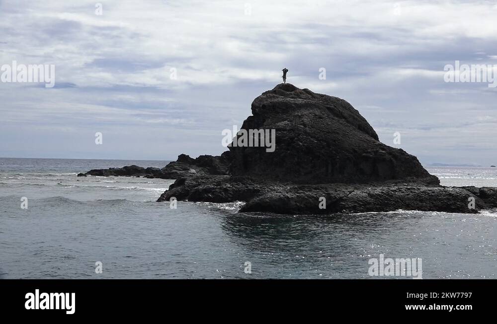 Indigenous Fijian man dance on a sea cliff in the Yasawa Islands of ...