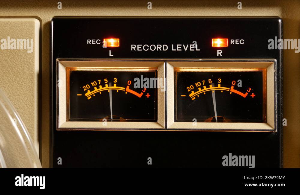 Analog vu meter of a vintage tape recorder machine while recording ...