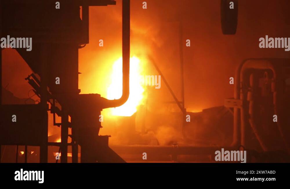 Fire bursting out of the chimney of iron melting furnace Stock Video ...