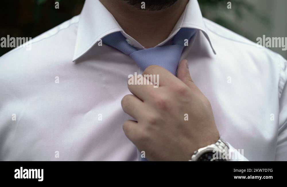 Fixing the tie Stock Videos & Footage - HD and 4K Video Clips - Alamy