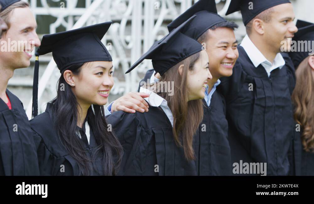 4K Happy students posing for photos on graduation day, 1 girl smiles to ...