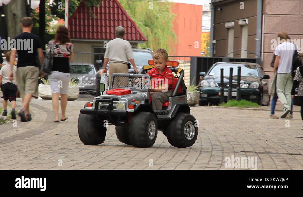 Boy in toy car Stock Video Footage - Alamy
