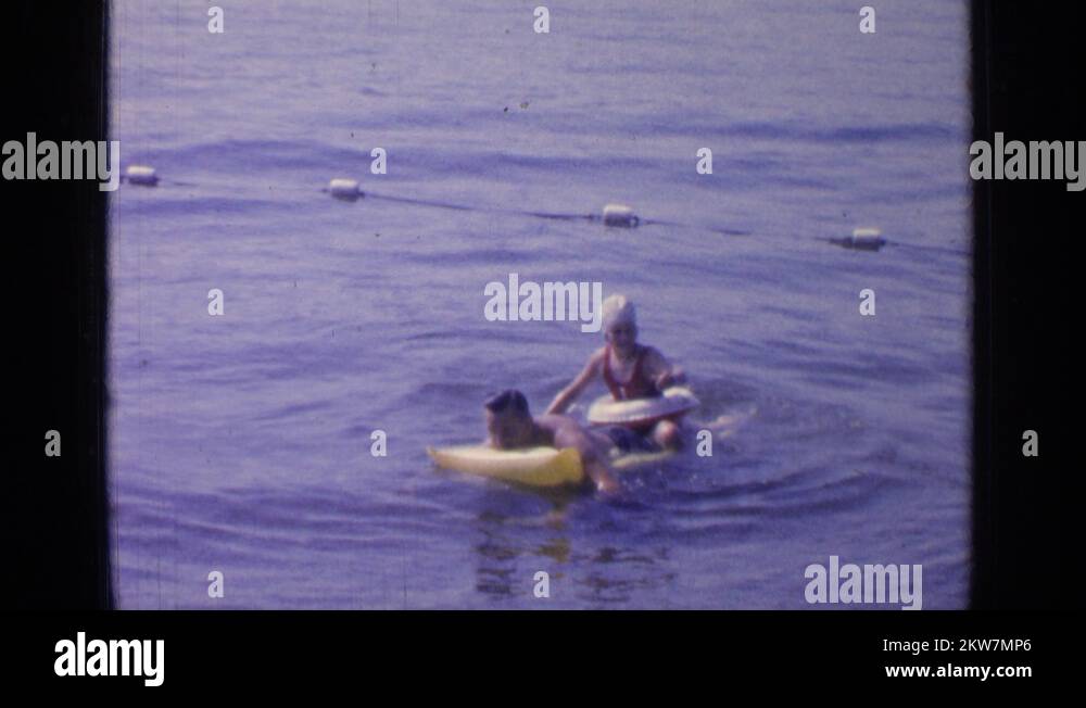 1964: father and daughter play on floatation device GREENWOOD LAKE NEW ...