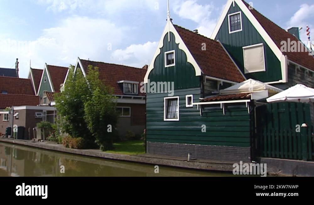 pan traditional green painted canal houses in 17th century village ...