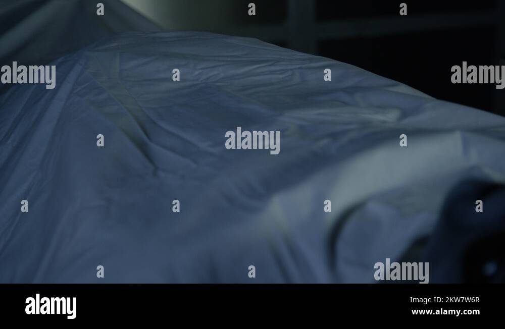 Alien Autopsy visitor on gurney in morgue Stock Video Footage - Alamy