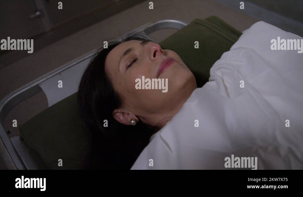 Morgue dead female body on gurney Stock Video Footage - Alamy