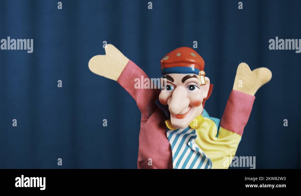 Jester hand puppet appears on scene with blue background, greeting ...