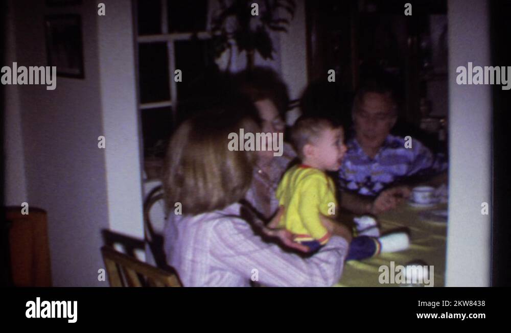 1979: family sit around dining table and try to comfort crying baby in ...