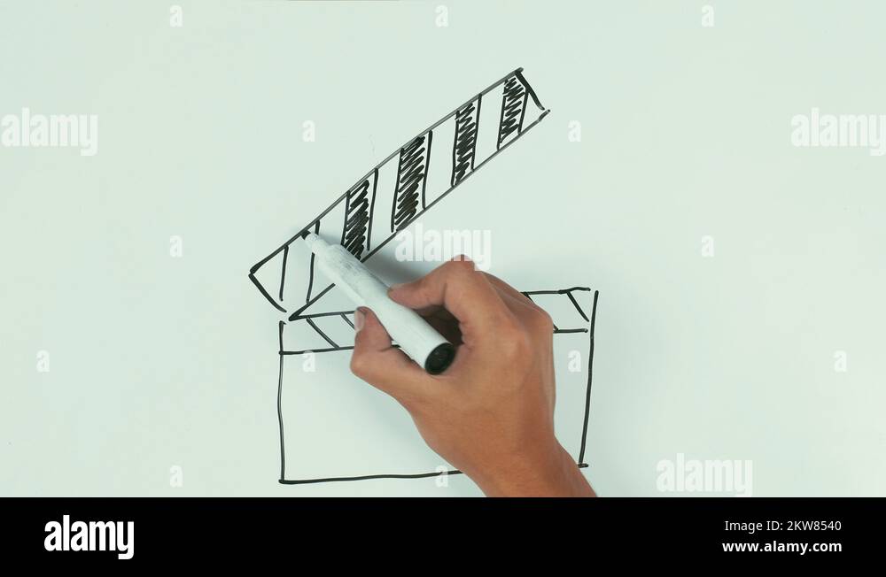 Man hand draw movie clapper using black marker pen on whiteboard and ...