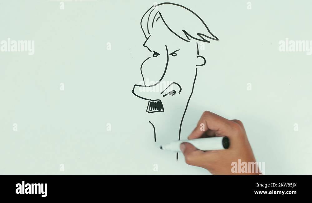 Man draw adolf hitler face caricature with black marker pen on ...