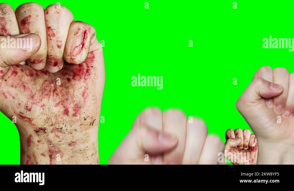 4k lot of different fists raising up in front of green screen ...