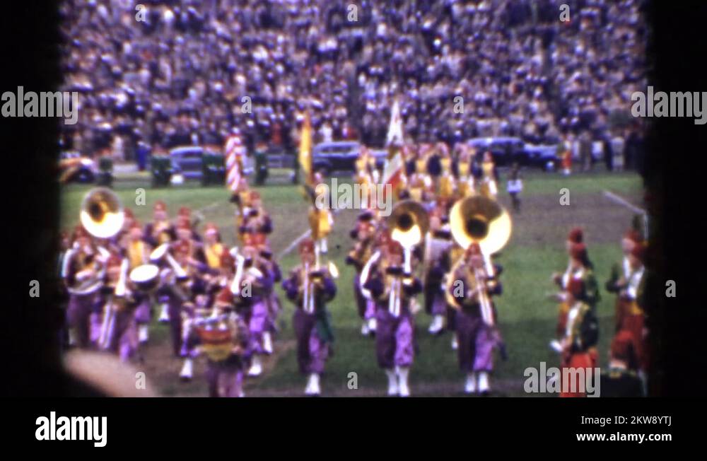 1944: marching band wearing blue satin outfits and red fezzes cross ...
