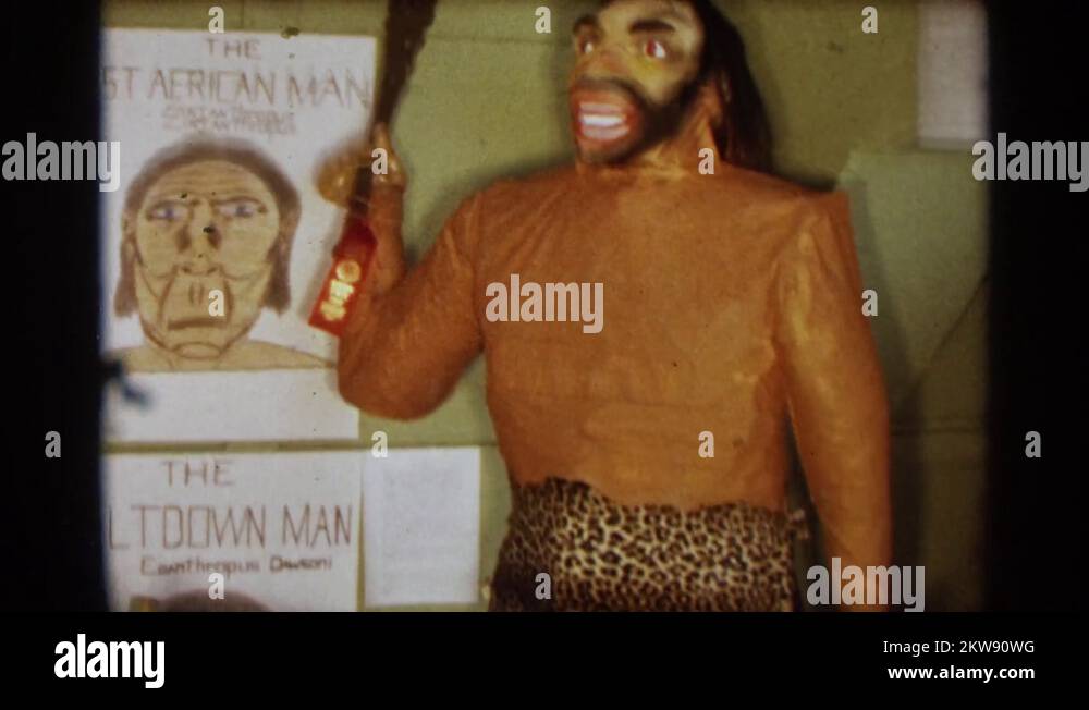 1963-human-evolution-chart-and-a-dummy-model-of-ancient-human-in-an