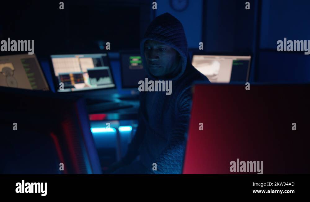 4k Hooded Computer Hacker Trying To Break A Code On Computer System 2321