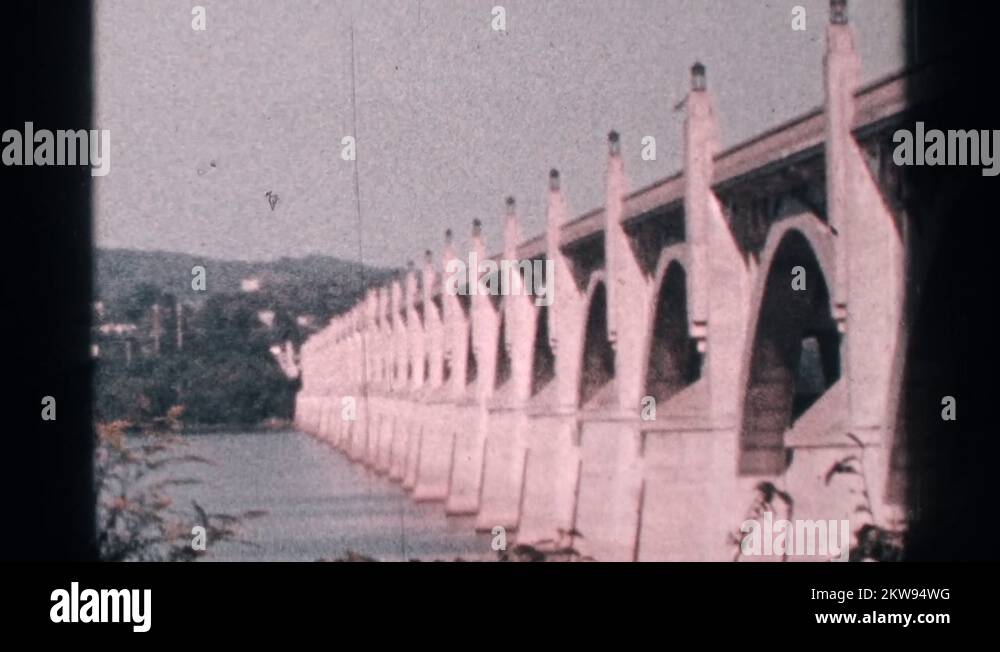 1964: beautiful dam structure with its reflection on the water ...