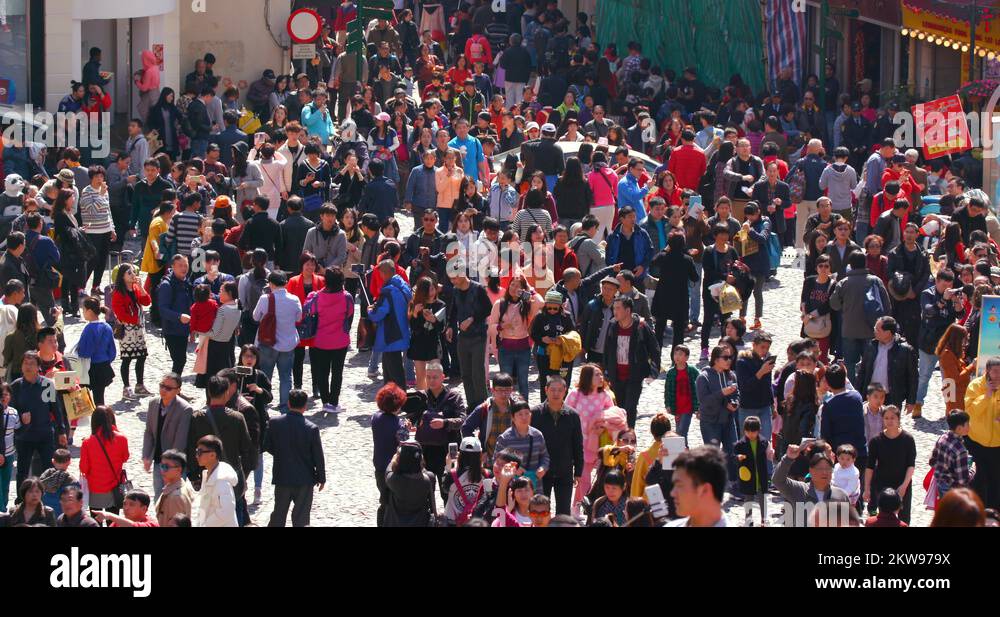 CROWDS PEOPLE COBBLED R DE SAO PAULO MACAU CHINA Stock Video Footage - Alamy