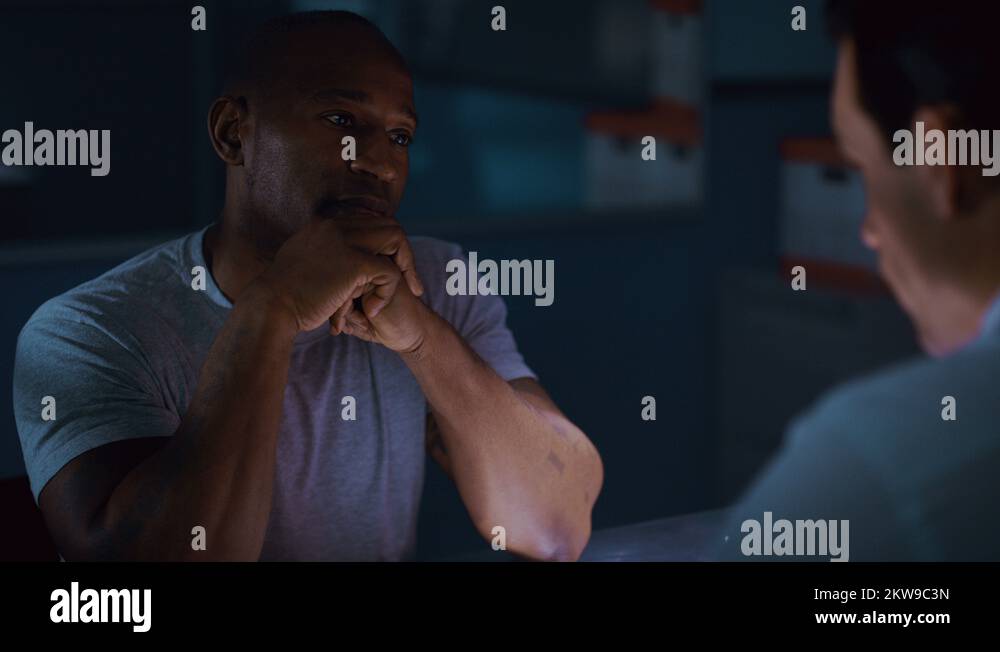 4K Crime suspect being questioned by police officer in interrogation ...