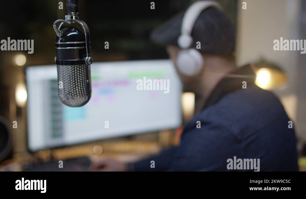 4K Singer recording & mixing a track in home recording studio Stock ...