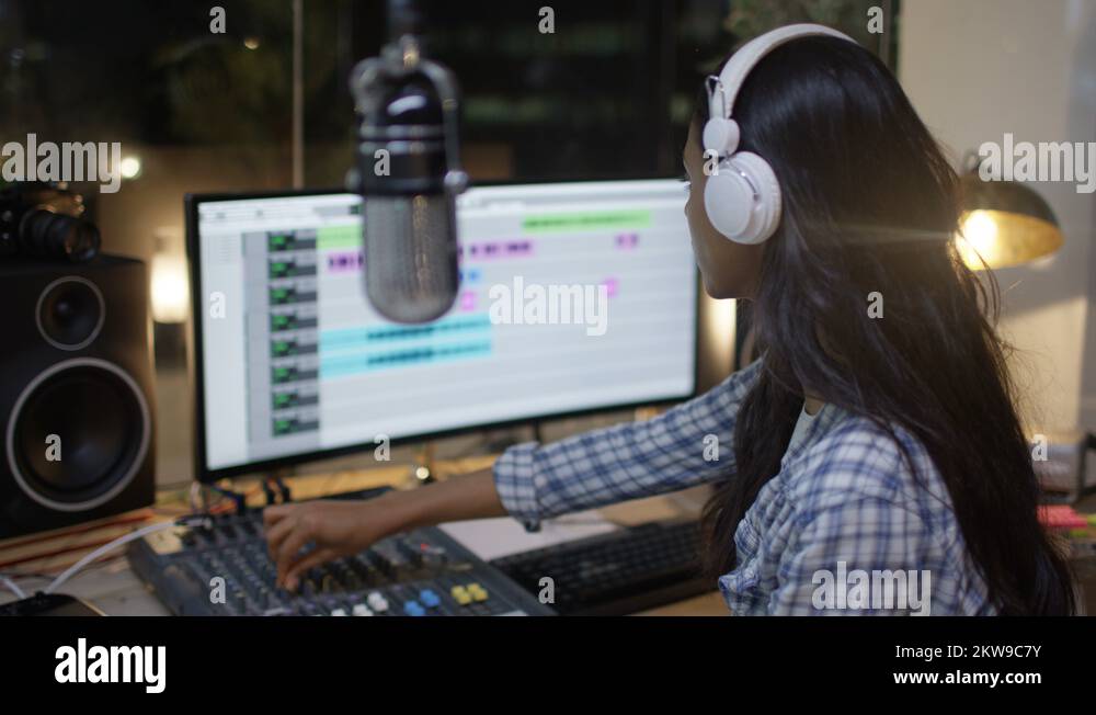 4K Singer recording & mixing a track in home recording studio Stock ...