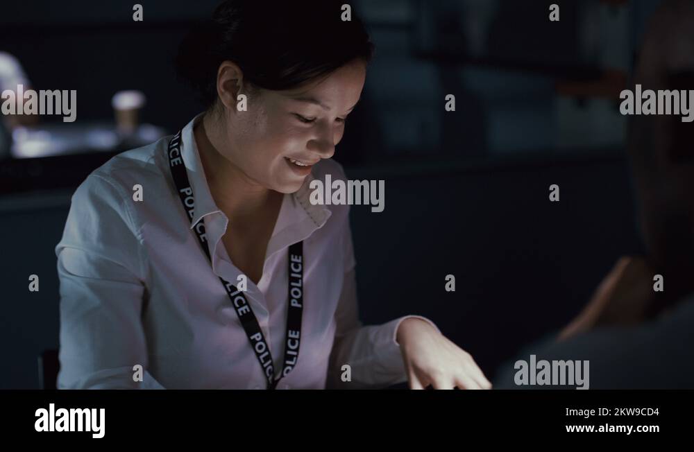 4K Female police detective questioning a crime suspect & showing him ...