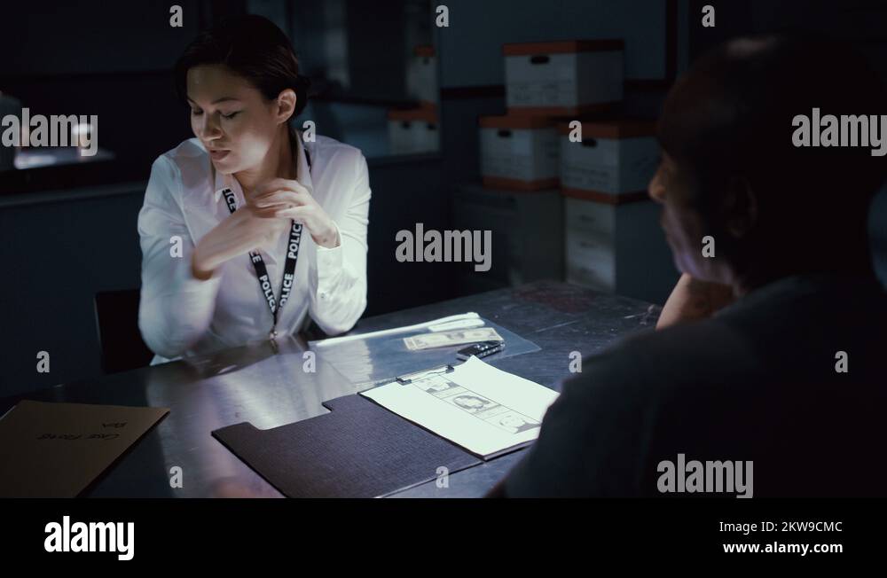 4K Female police detective questioning a crime suspect in interrogation ...