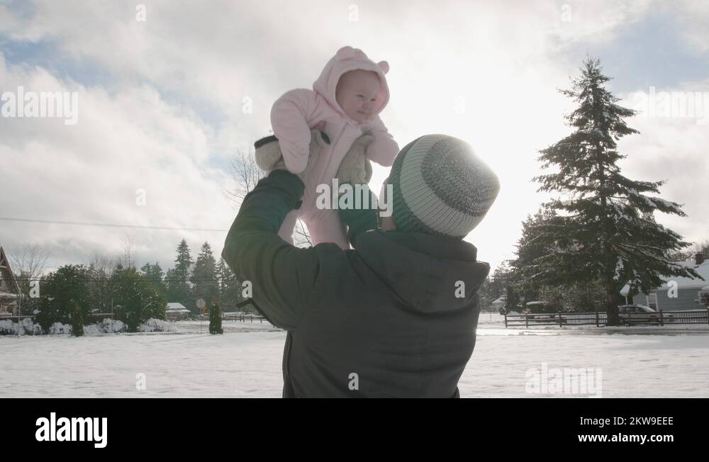 Dad Throwing Up and Catching Baby Girl Kissing Daughter Outside Playing ...