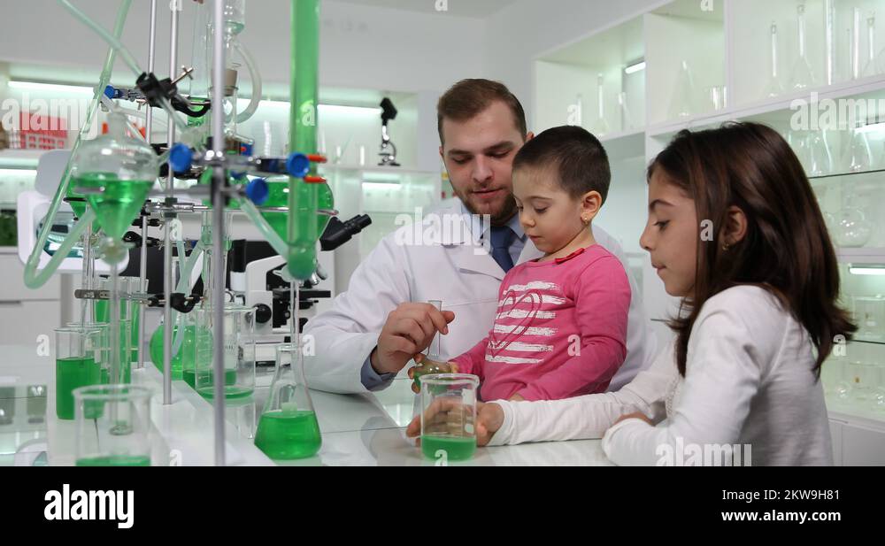 Dad Teaching His Kids How Chemistry Work Girls Playing in Research ...