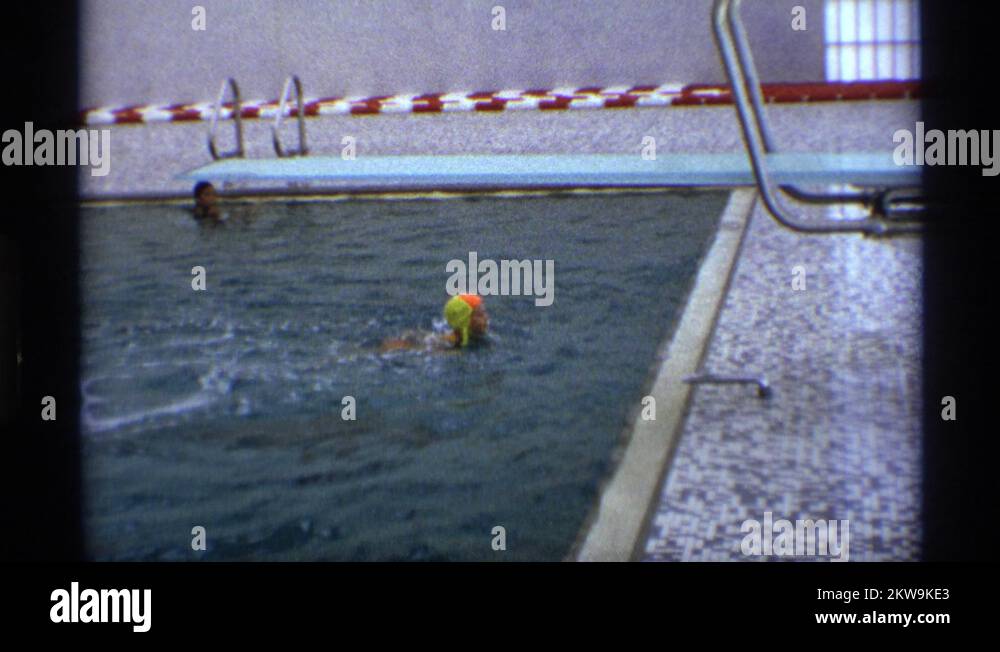 1971: a small girl swimming at the swimming pool and wake up from the ...