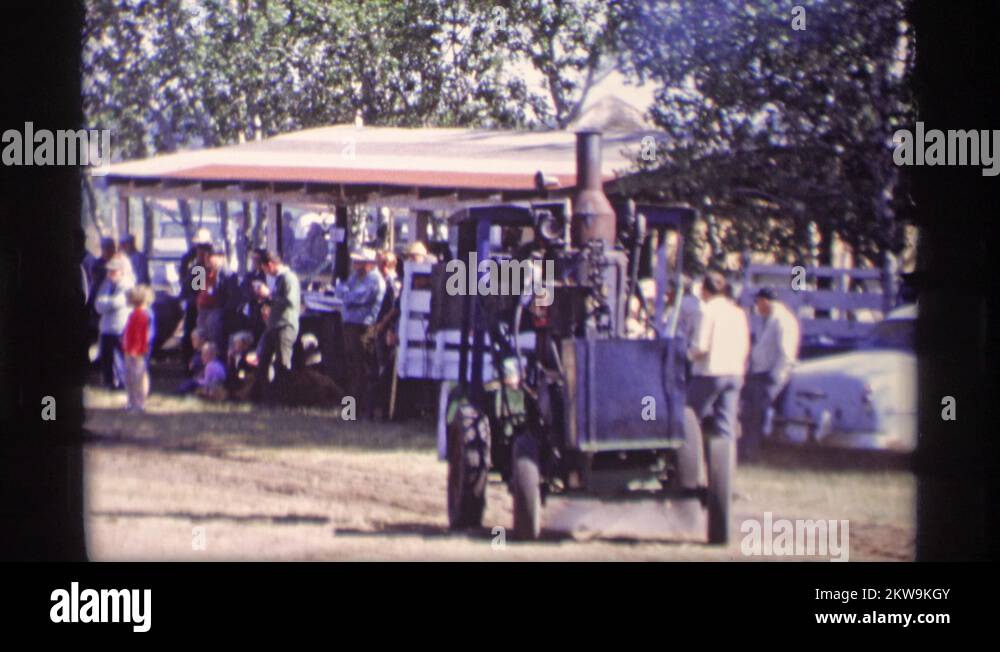 1969: man shows off his steam engine locomotive to a crowd of people ...