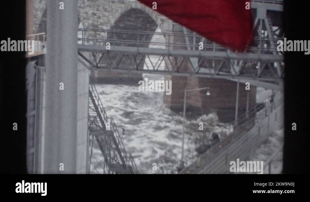 1969: view of the base of a bridge with water sloshing around and a ...