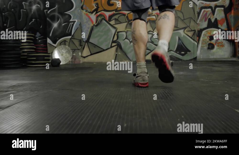 Athlete power walking on his hands and push ups standing upside down in ...
