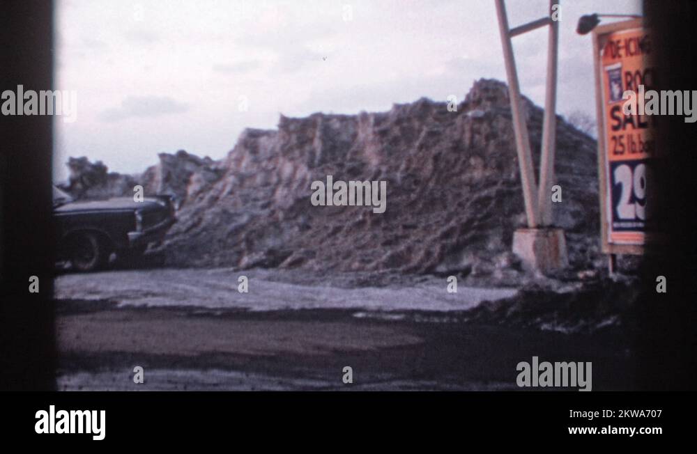 1971: car parked near de-icing salt pile and signage for salt being ...