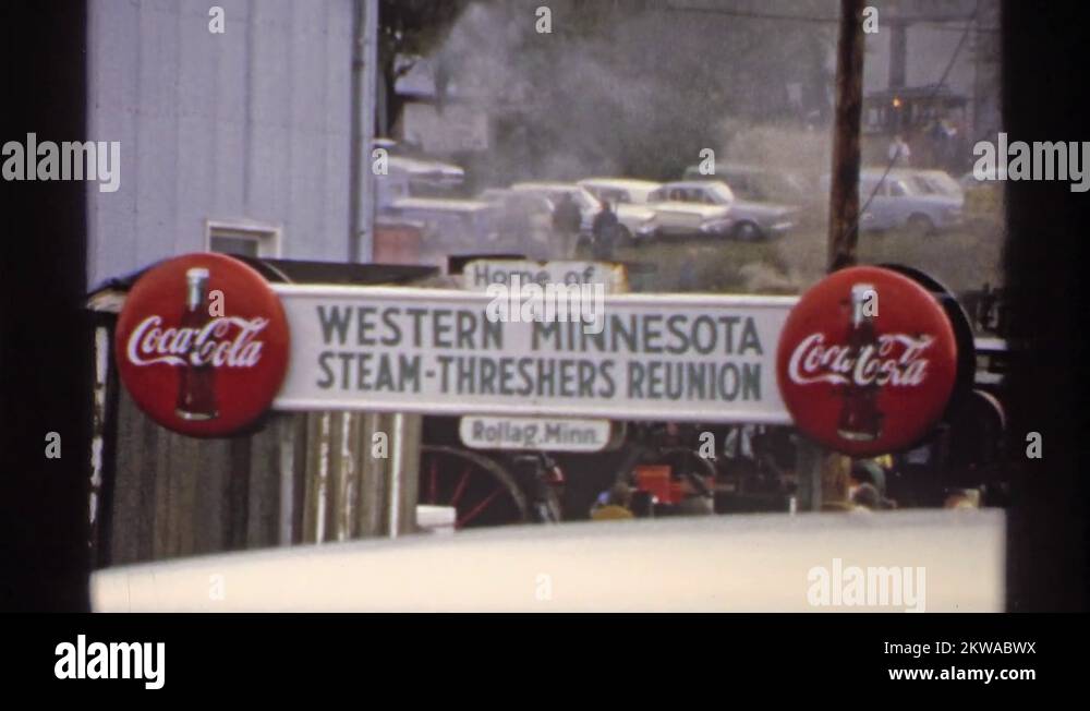 1971: sign announcing steam-threshers reunion is between two coca-cola ...