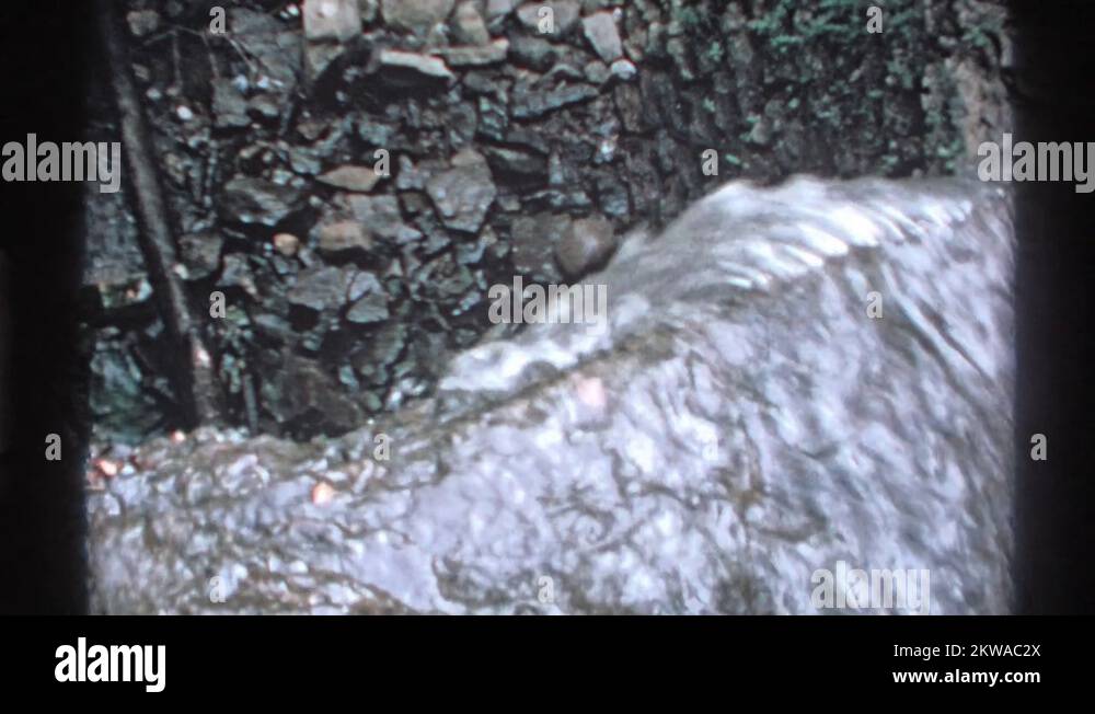 1972: water flows over sharp edge toward gravel and moves along lower ...