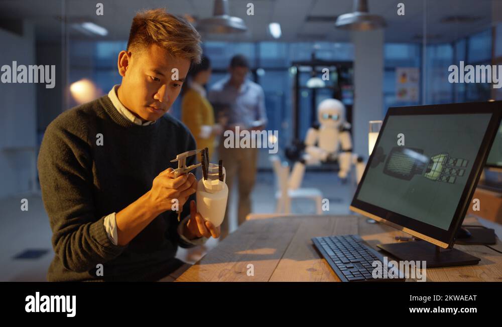 4K Electronics engineering team using 3D printed components to create a robot Stock Video ...