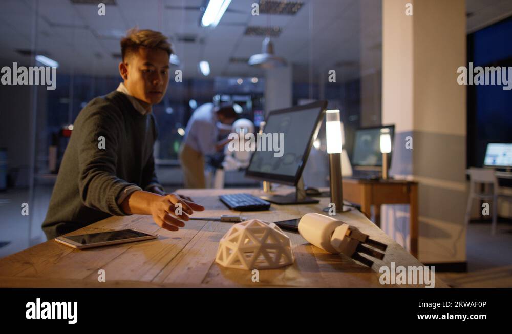 4K Electronics engineers building automated robot using 3D printed ...