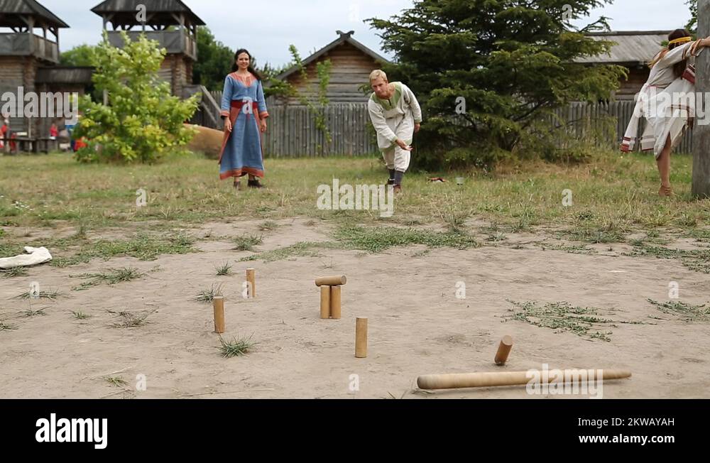 Actors plays gorodki in Kyivan Rus park, Kopachiv village, Ukraine ...