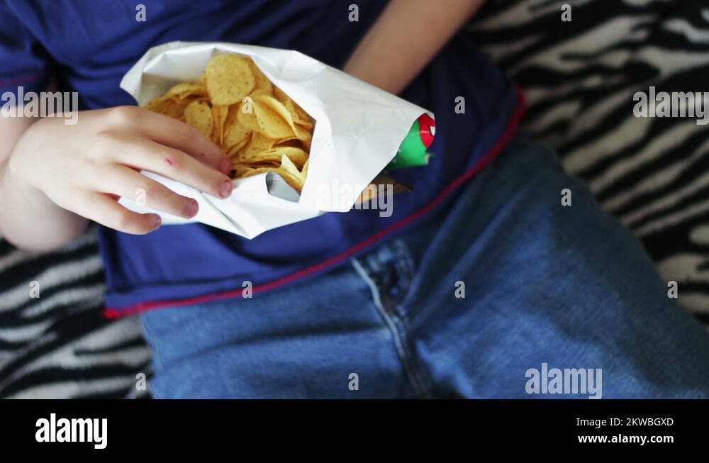 Boy Eating Packet Of Potato Chips unhealthy food Stock Video Footage ...