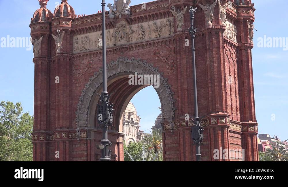 Iconic landmark Arch of Triumph in Barcelona city red color tourism ...