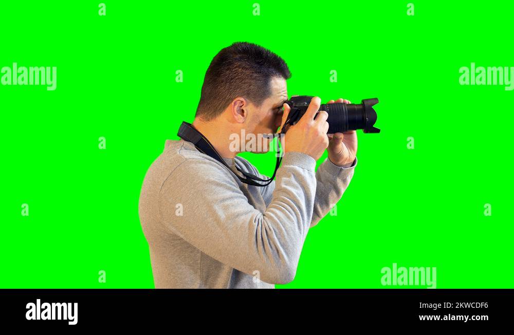 Greenscreen Photographer Side View Focusing and Zooming to Take Picture ...
