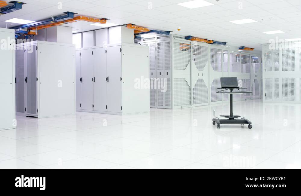 4K Empty interior of large modern data centre with rows of server racks ...