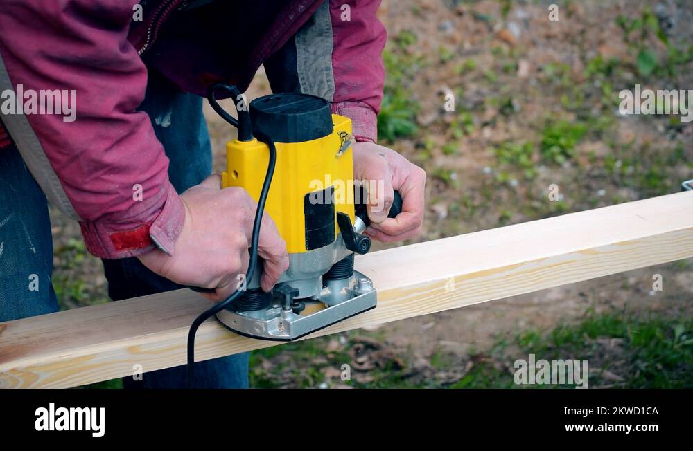 Working on a wooden plank with plunge router Stock Video Footage - Alamy