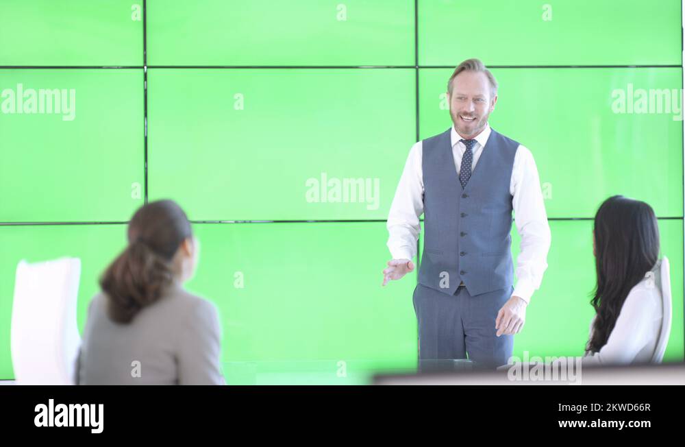 4K Business team in a meeting,man interacting with green screen ...