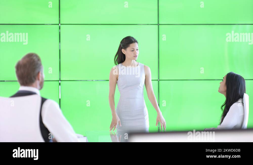 4K Corporate business team in a meeting with green screen background ...